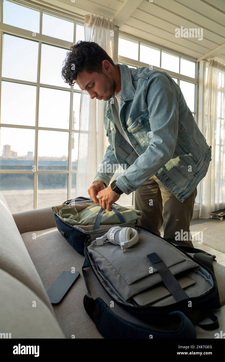 Backpack headphones on sofa hi-res stock photography and images - Alamy