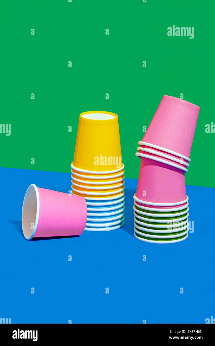 Disposable cups stacked against two tone colored background Stock Photo ...