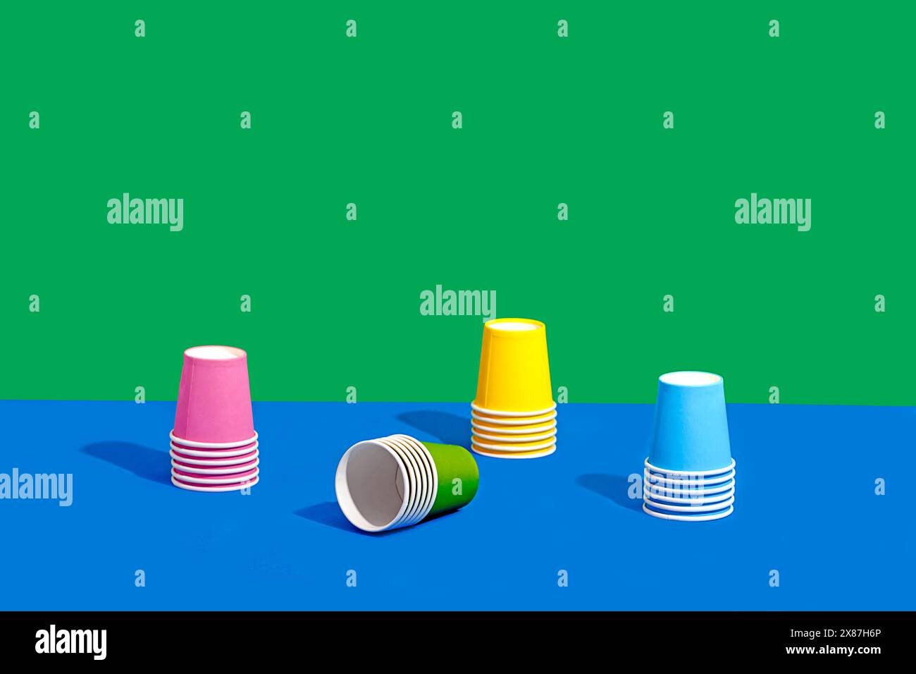 Colorful paper cups stacked against two tone colored background Stock ...