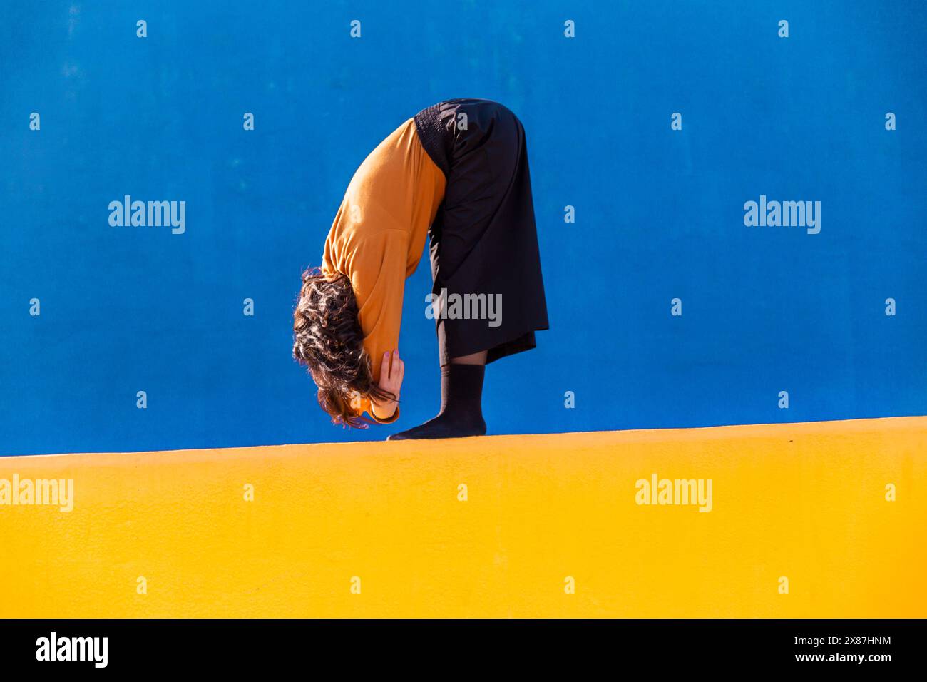 Bending forward hi-res stock photography and images - Alamy