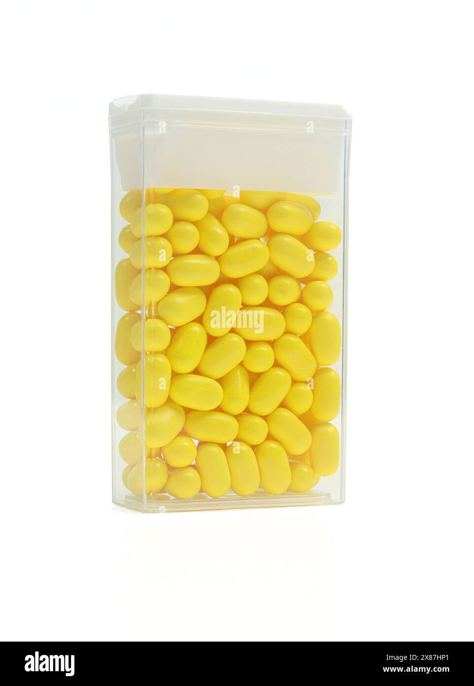 Yellow dragee pill mints candy packaging isolated on white background ...