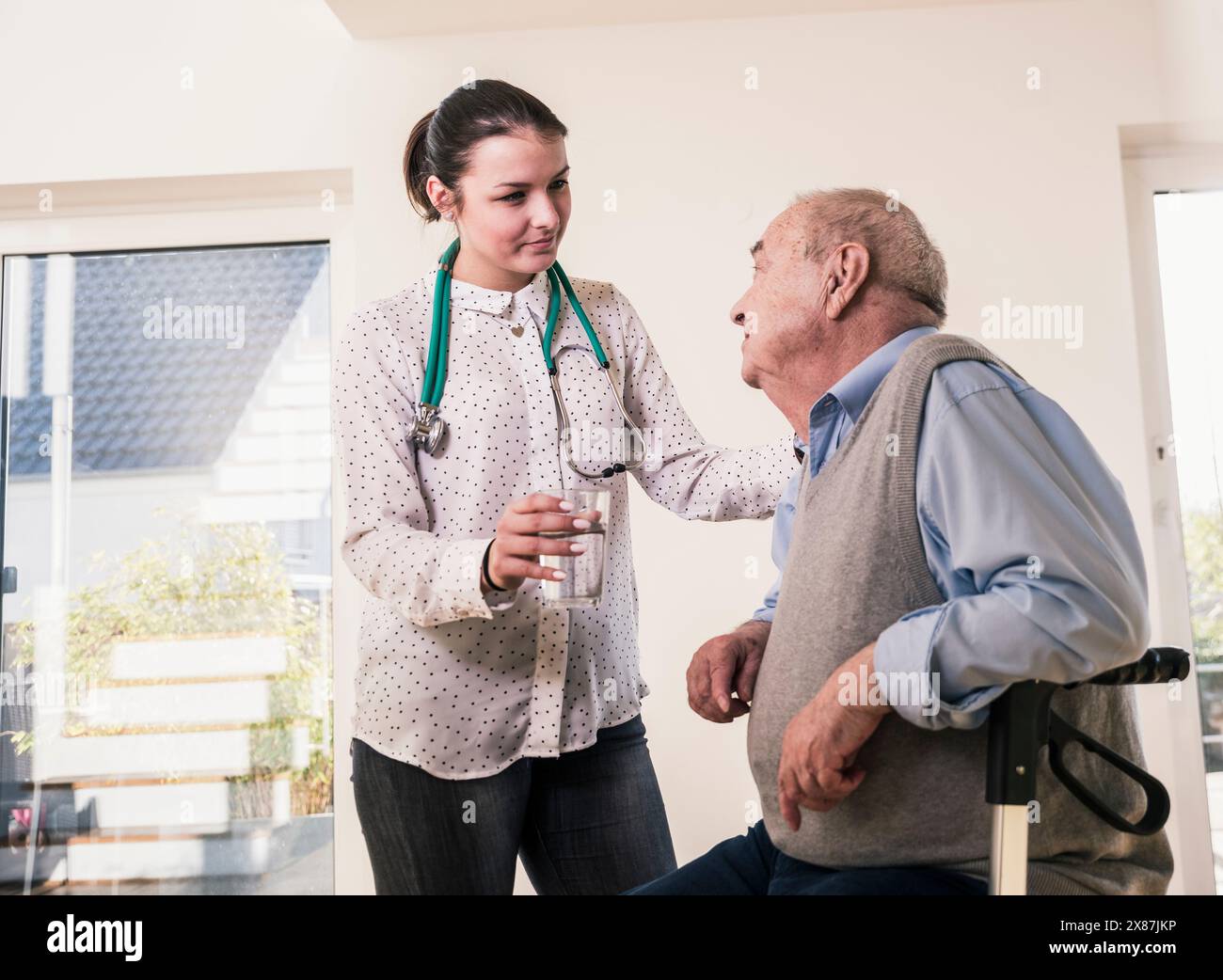 Female doctor drinking water hi-res stock photography and images - Alamy