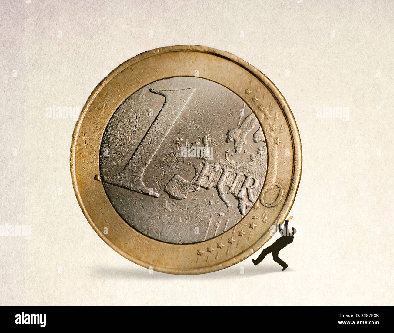 Businessman getting crushed under oversized one euro coin Stock Photo ...