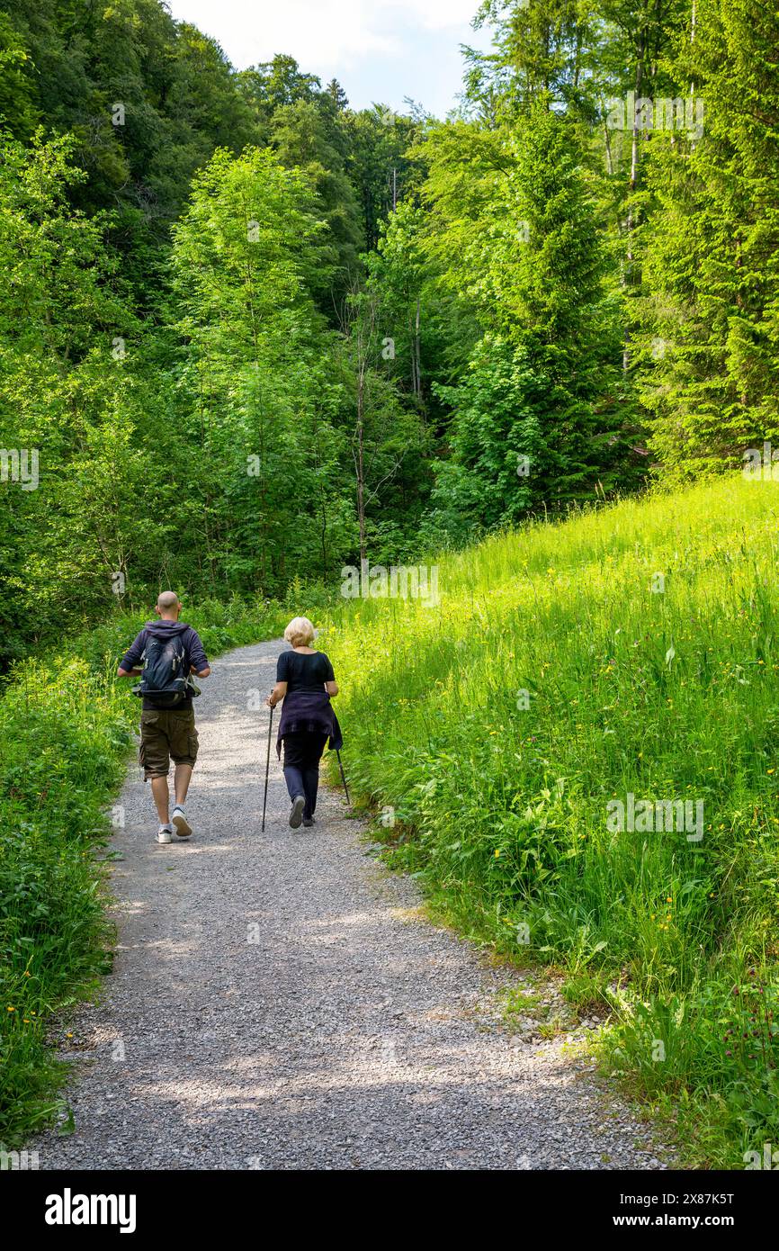 Senior woman walking amidst plants hi-res stock photography and images ...
