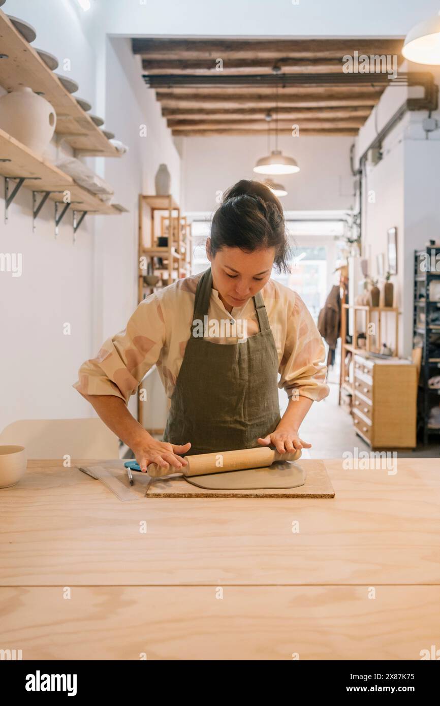 Woman focused on rolling out hi-res stock photography and images - Alamy