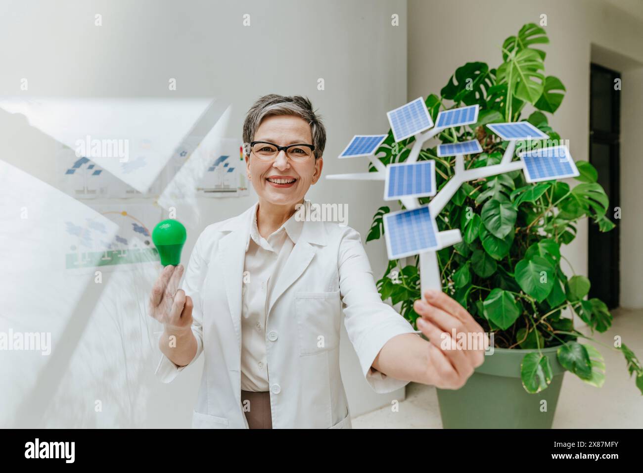Female engineer holding energy panels hi-res stock photography and ...