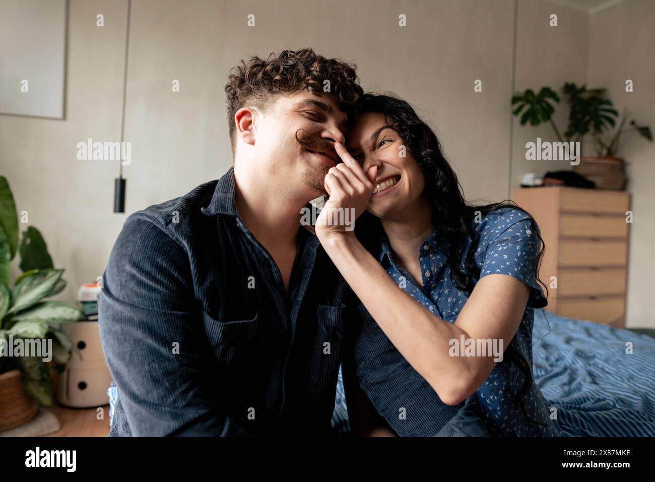 Man touching woman nose hi-res stock photography and images - Alamy