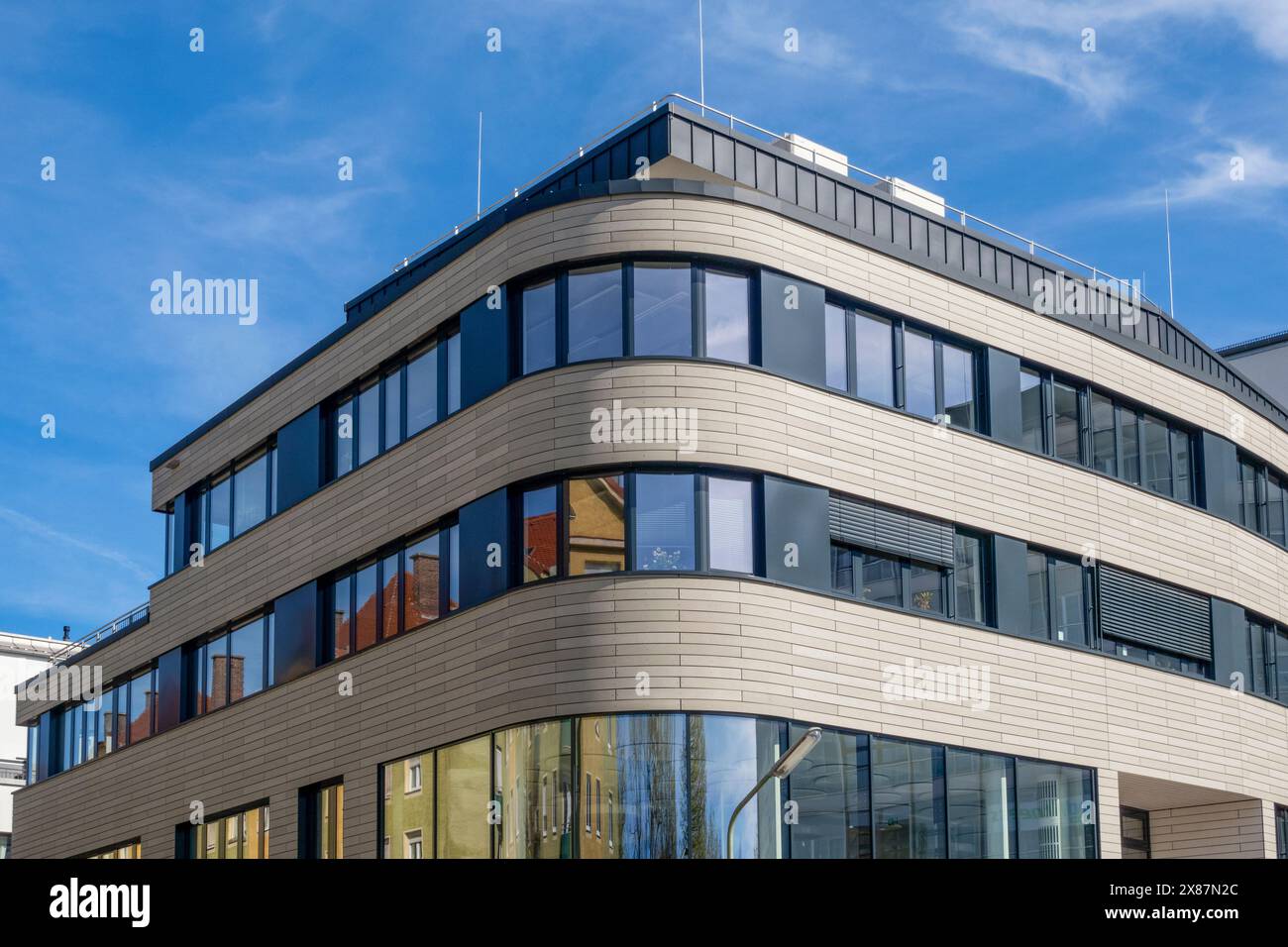 Germany, Bavaria, Munich, Glass facade of modern office building Stock ...