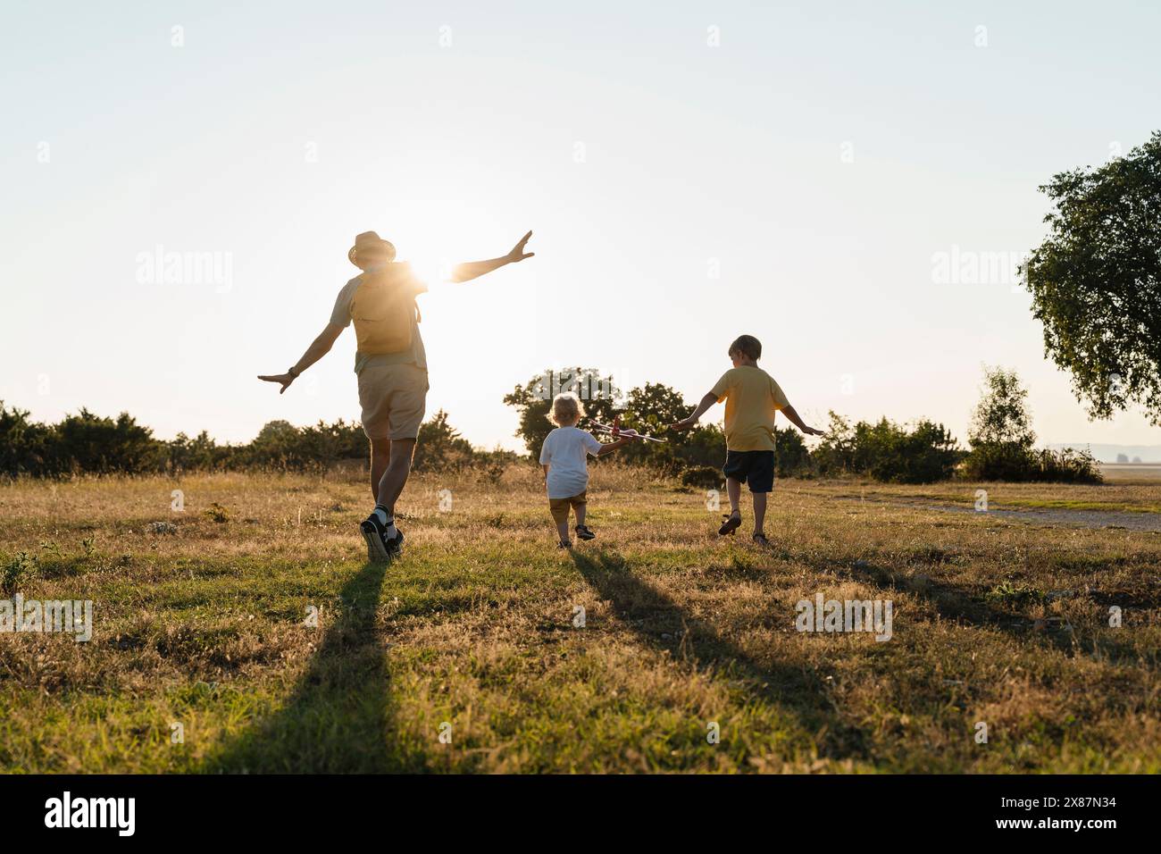 Family two sons walking together hi-res stock photography and images ...