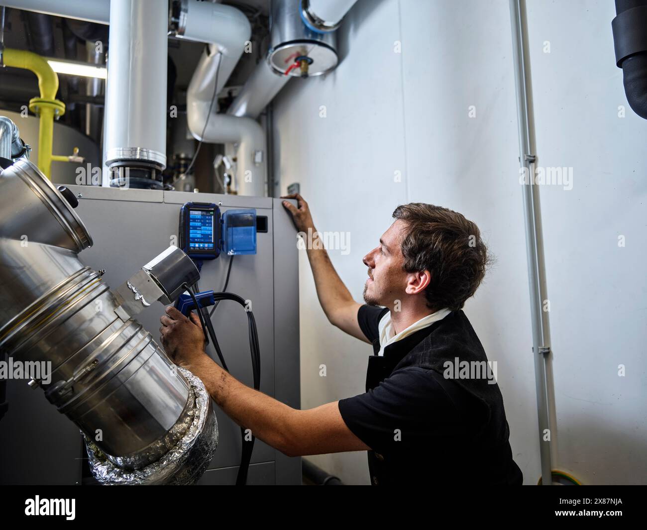 Man in boiler room working hi-res stock photography and images - Alamy