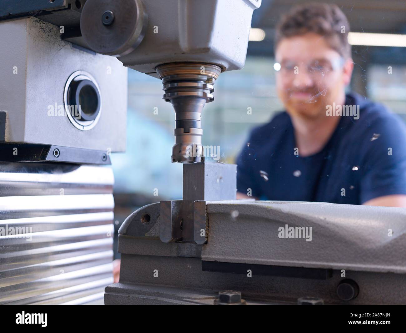 Woman worker operating drill hi-res stock photography and images - Alamy