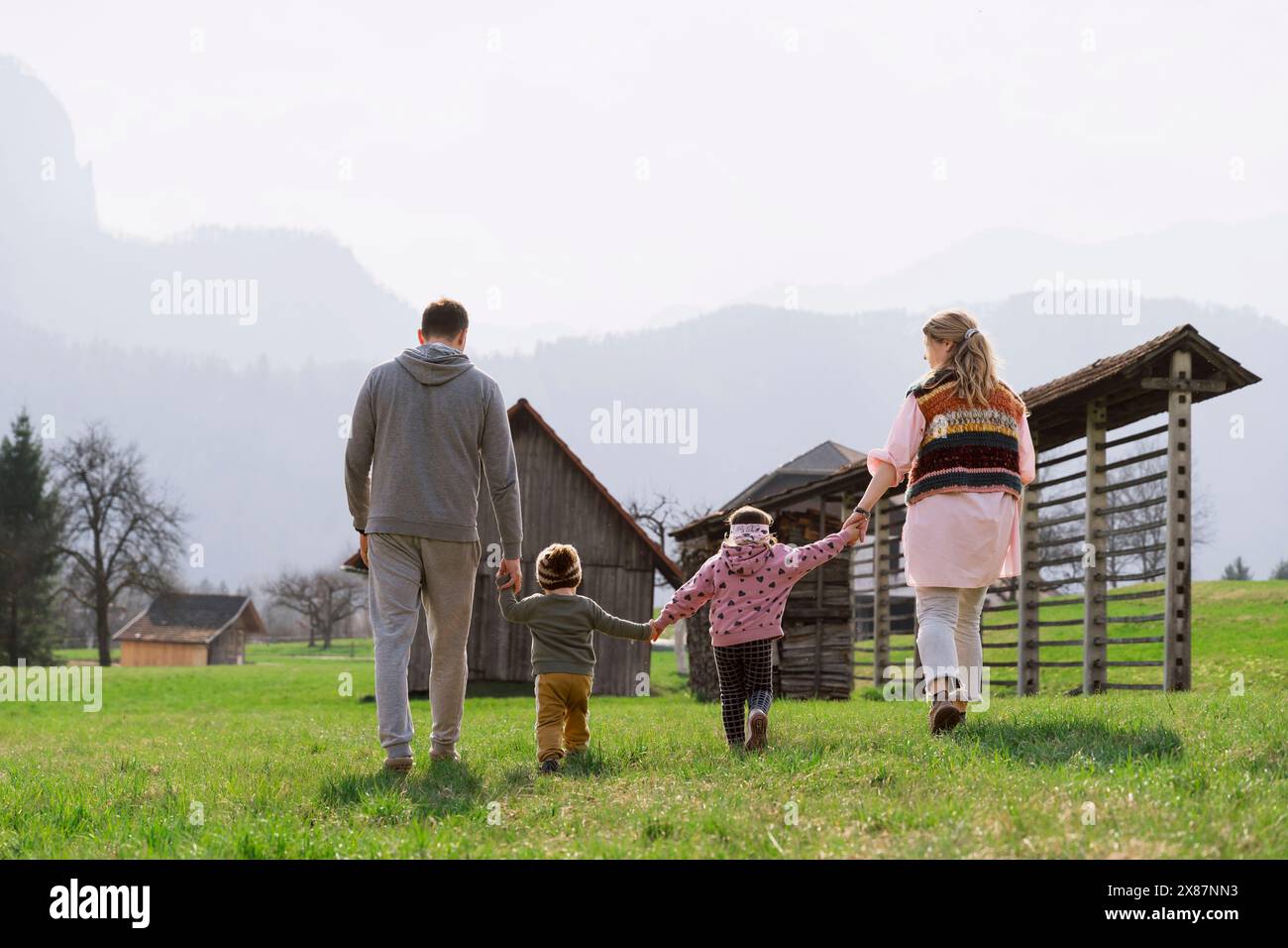 Children parents walking home hi-res stock photography and images - Alamy
