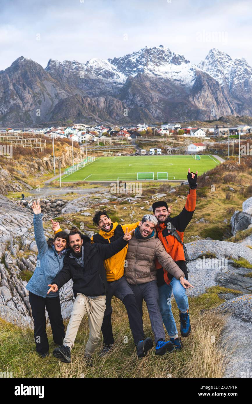 Norway, Northern Norway, Henningsvaer, Group of friends posing in ...