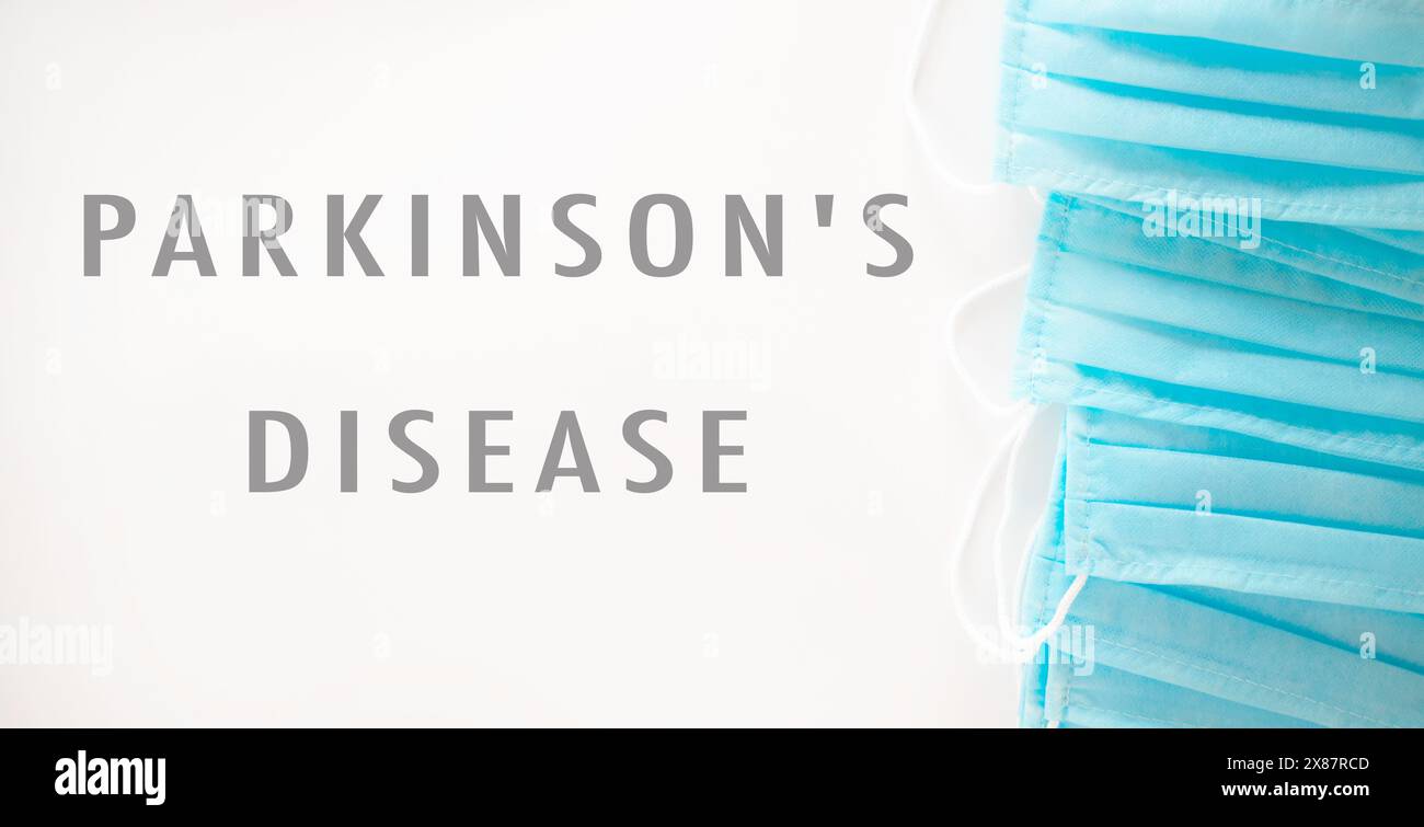 A stack of blue surgical masks with the words Parkinson's disease ...