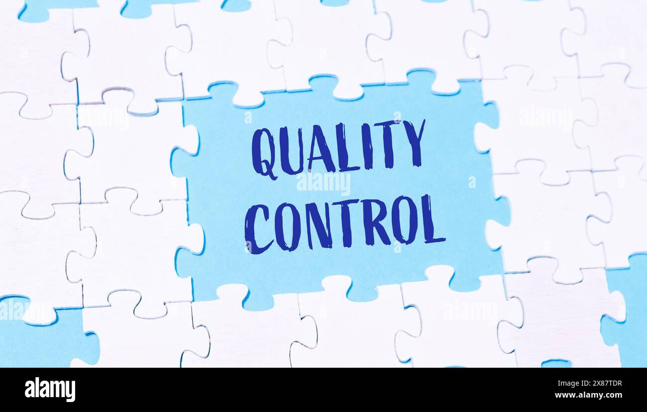 A puzzle with the word quality control written in blue Stock Photo - Alamy
