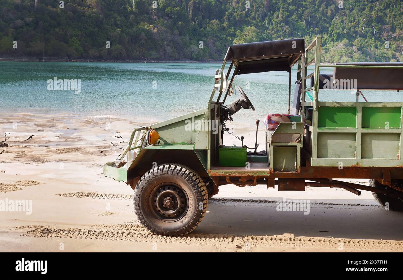 Side view an old vintage AIL Abir car parking on the sand by seaside ...