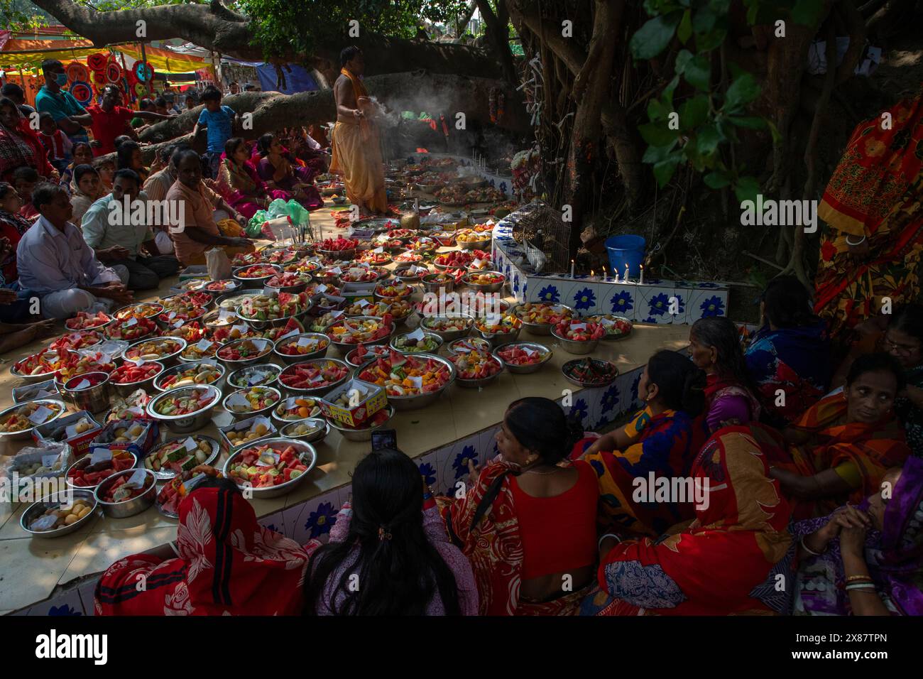 Devotees gather to worship the banyan tree near Sonargaon Upazila ...
