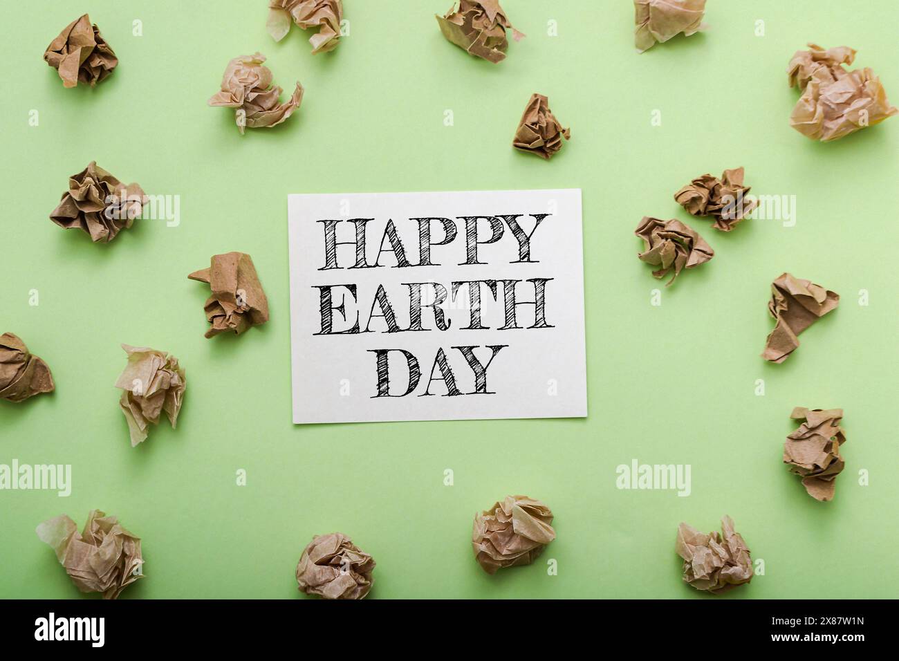 A pile of paper with the words Happy Earth Day written on it Stock ...