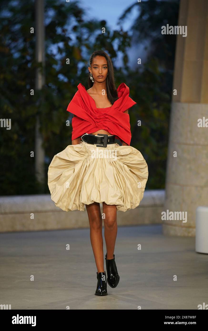A model wears a creation by Louis Vuitton during a fashion show for the ...