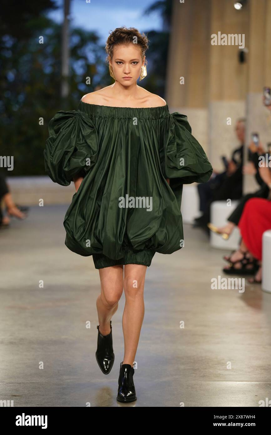 A model wears a creation by Louis Vuitton during a fashion show for the ...