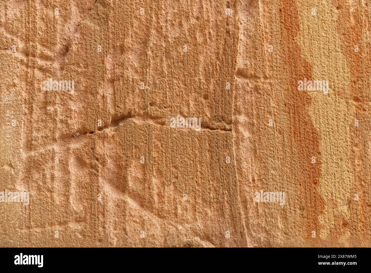 A detailed view of a weathered stone surface showcasing natural ...