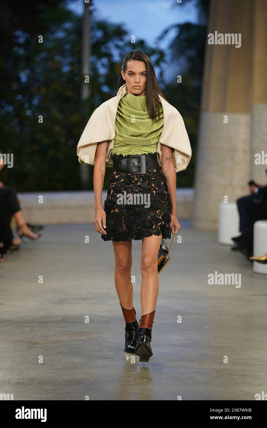 A model wears a creation by Louis Vuitton during a fashion show for the ...