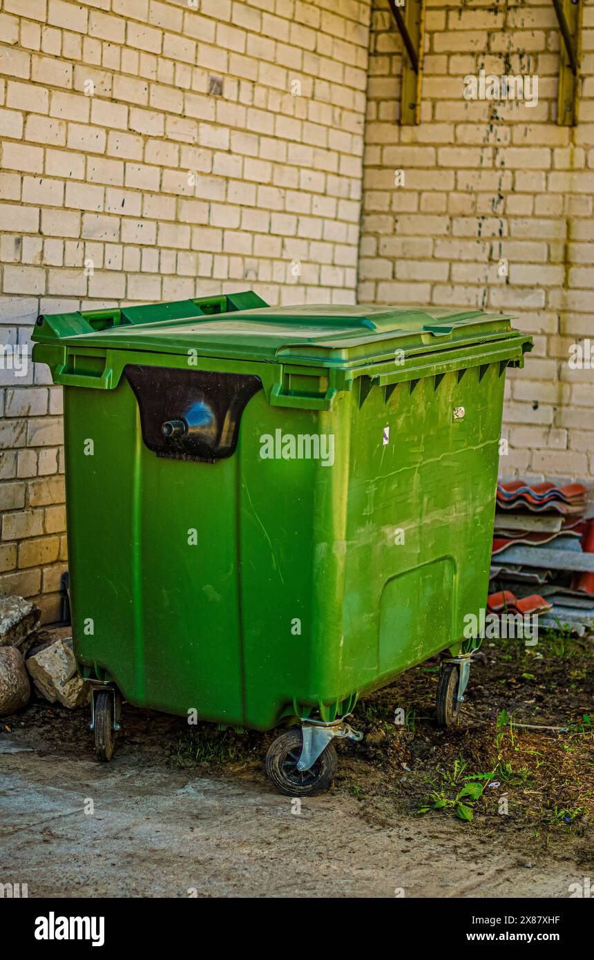 Plastic garbage cans of green color for separate collection of garbage ...