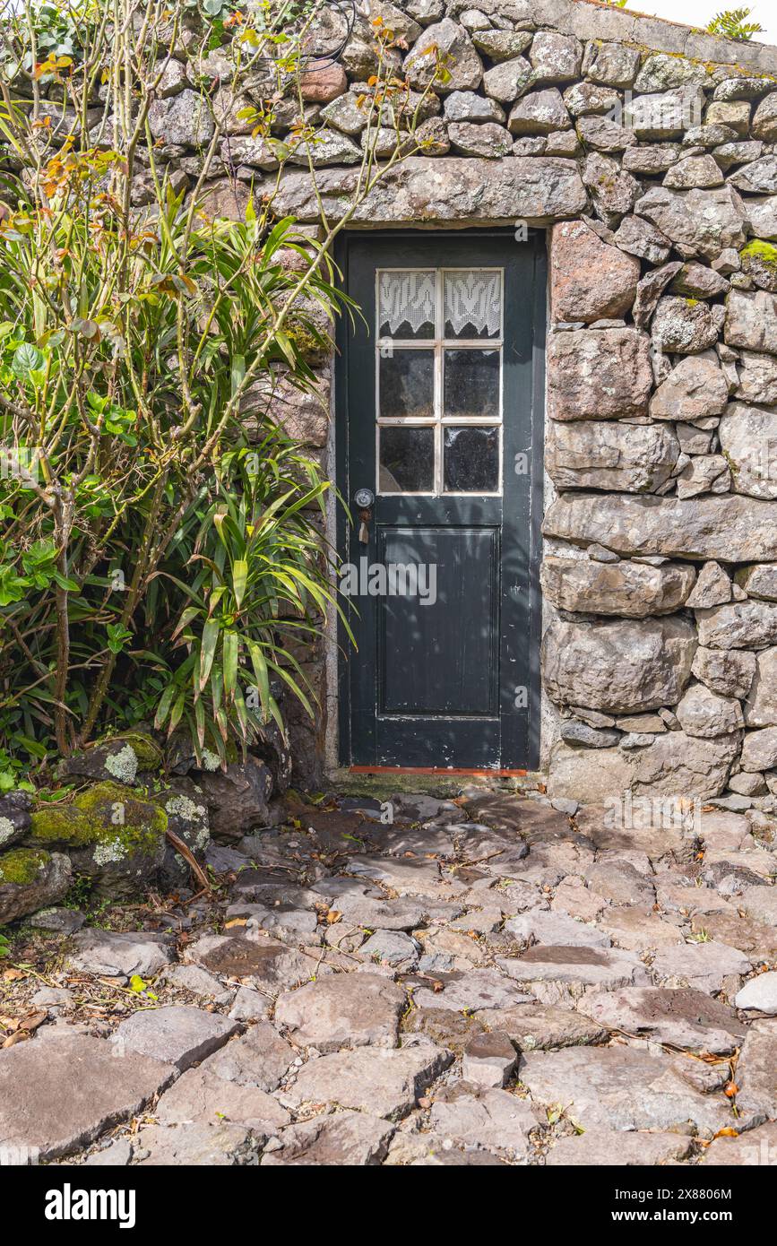 Aldeia da Cuada, Flores, Azores, Portugal. Door in a stone building ...