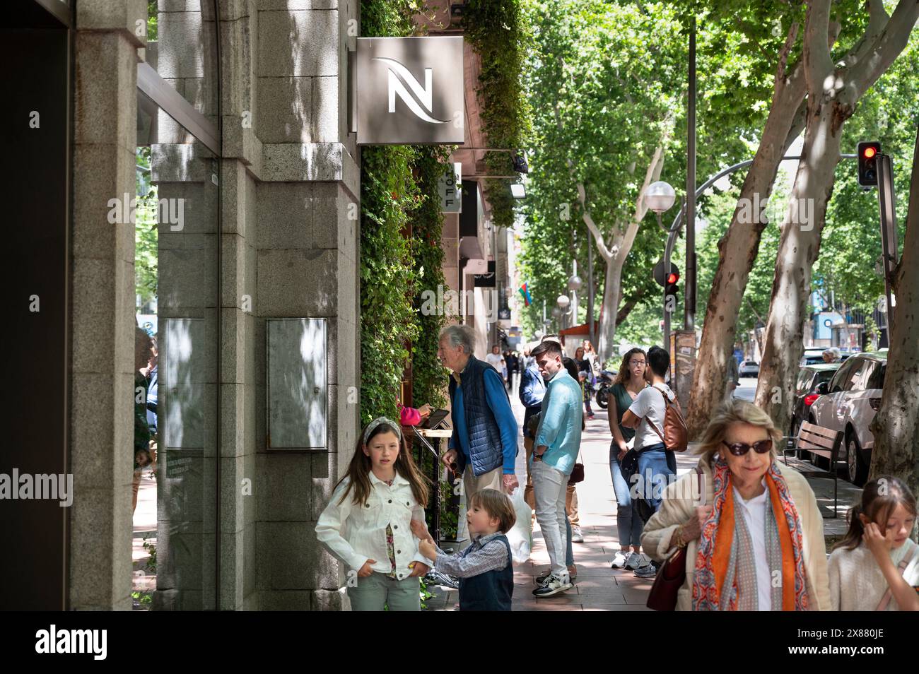 Pedestrians walk past the Swiss high-end and world leader in coffee ...
