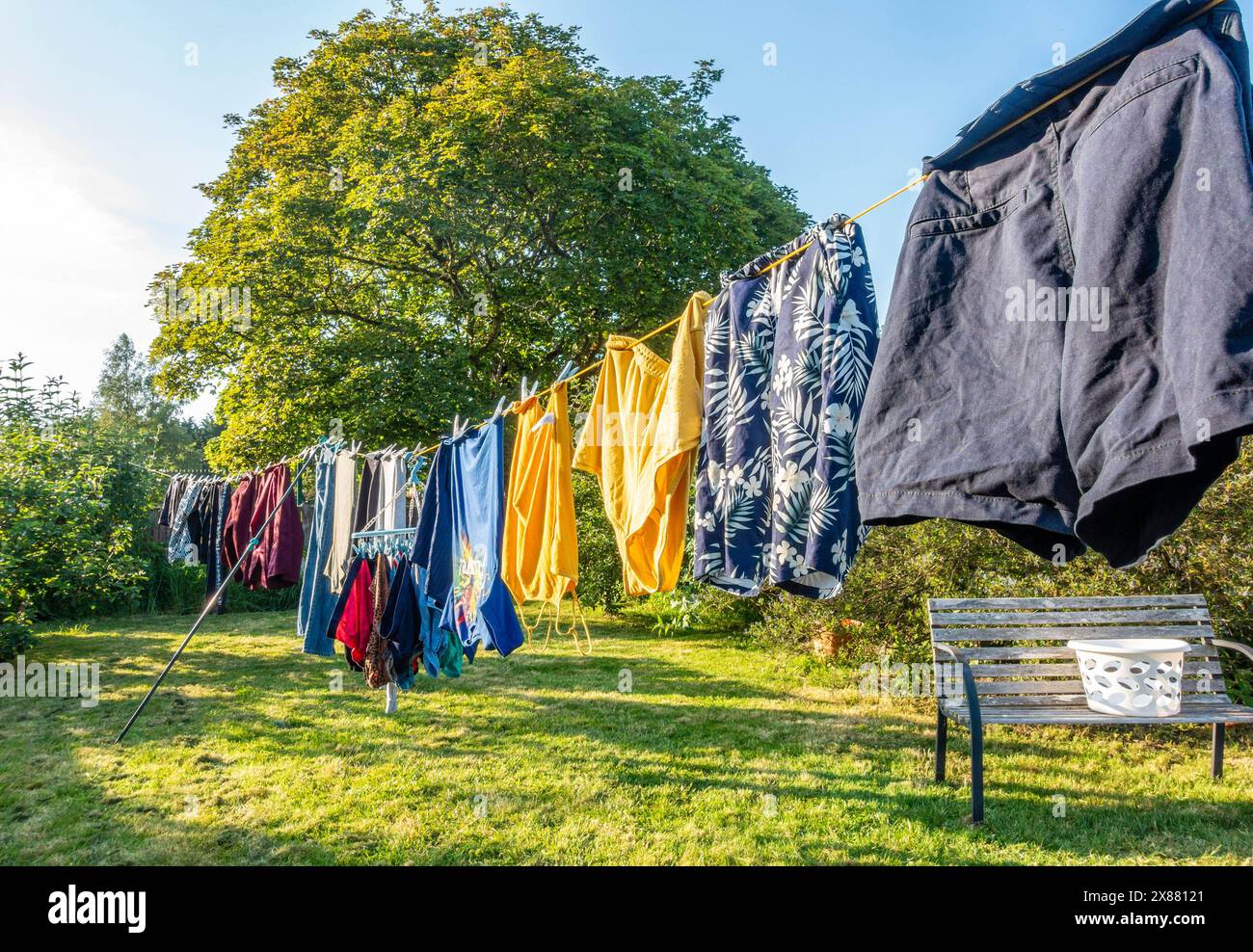 Washing drying on a washing line, catching the last of the day's ...