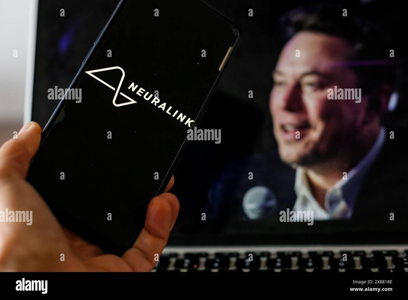 In this photo illustration, the Neuralink logo is seen displayed on a ...