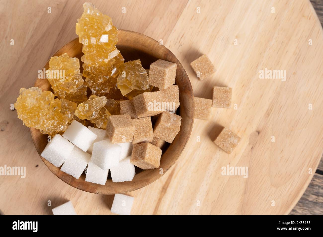 Traditional Uzbek navat sugar, cane sugar and refined sugar in wooden ...