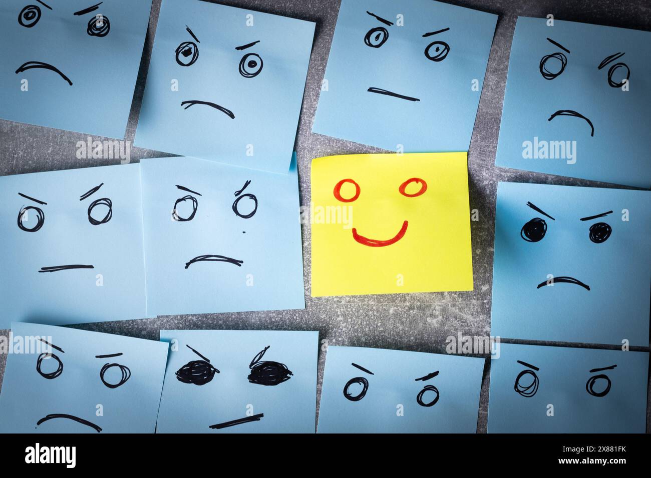 Concept positive attitude. Pieces of paper for notes with sad and angry ...