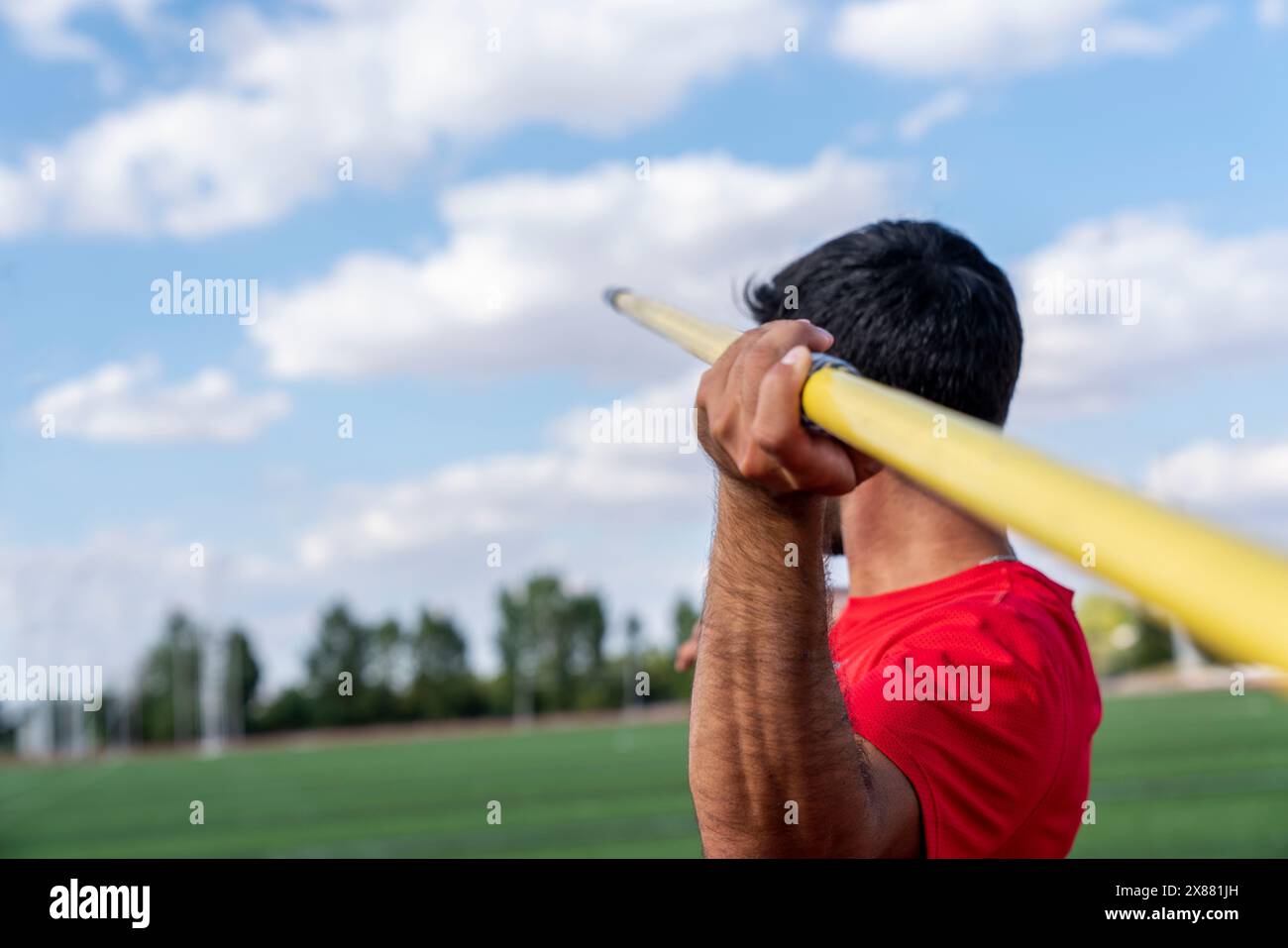 An athletic man throws the javelin in the stadium Stock Photo - Alamy