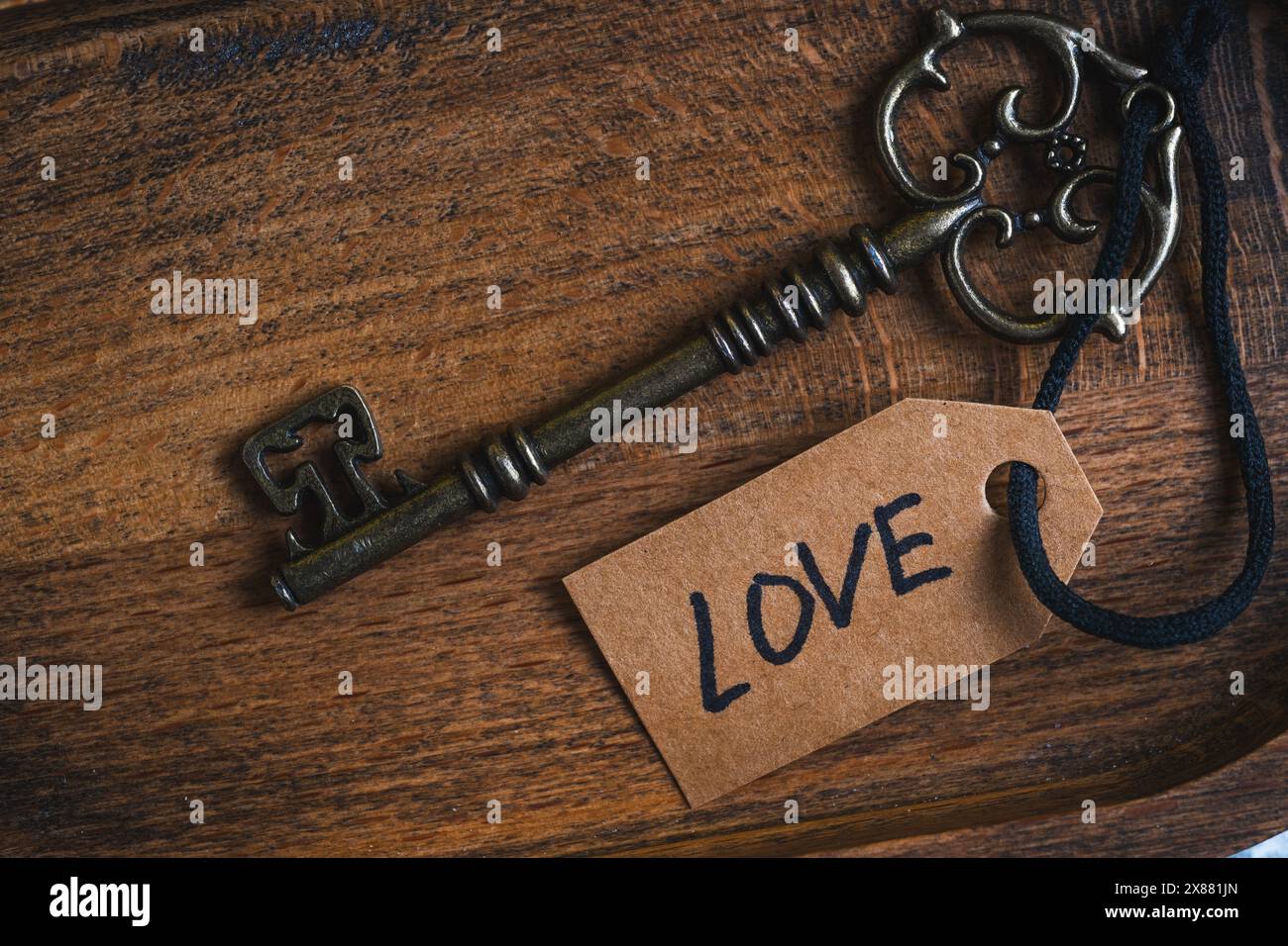 Vintage key with tag and inscription love on it. Concept love and ...
