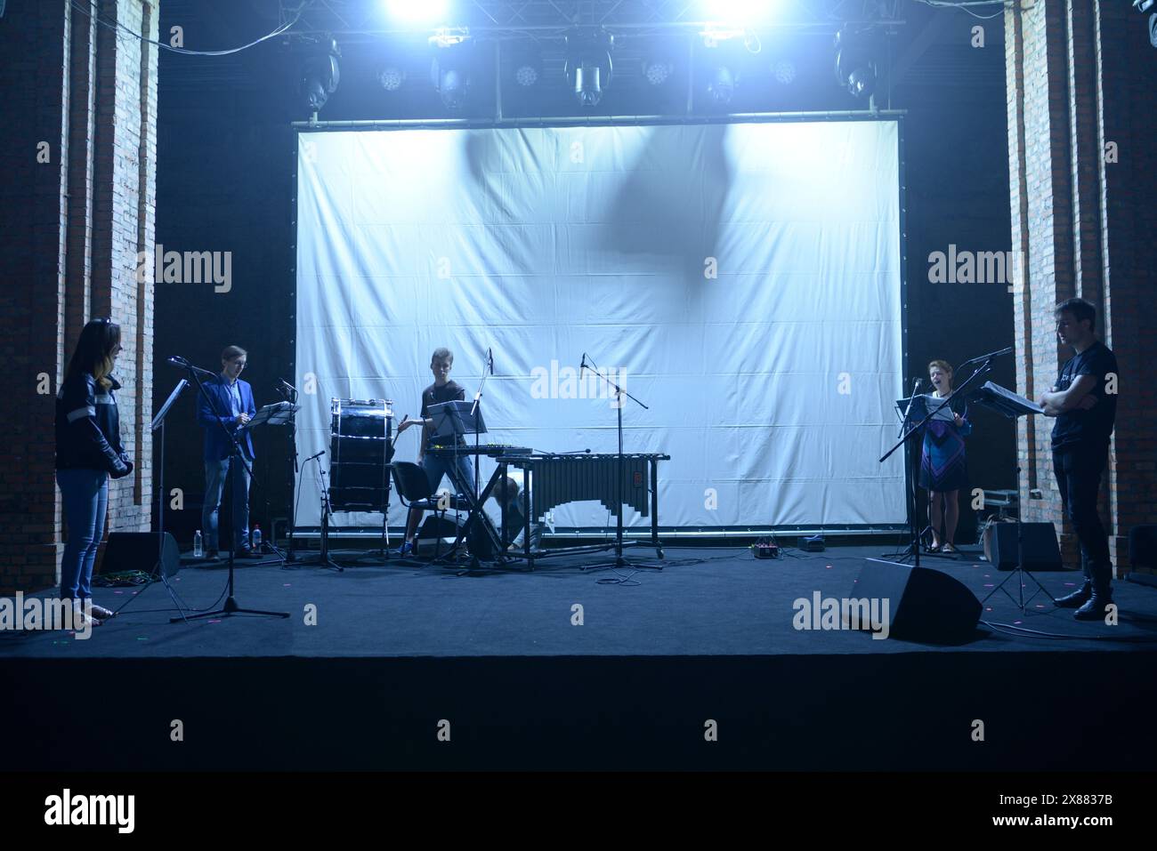 Artists on a stage performing poetry declamation performance Stock ...