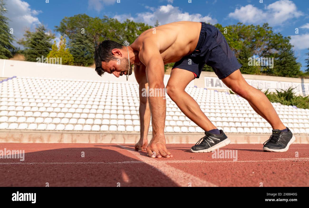 Stadium, man running and start block of athlete on a runner and arena ...