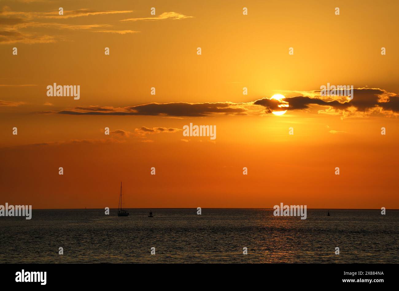 Golden sunset seen from River Wyre shore footpath at Knott End-on-Sea ...