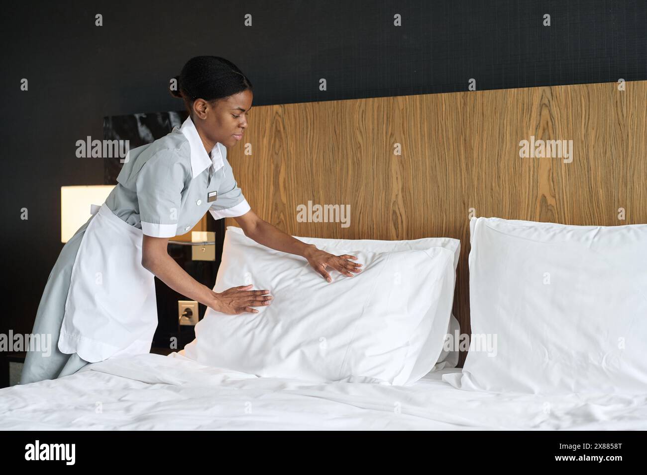 Side view portrait of young African American woman working as ...