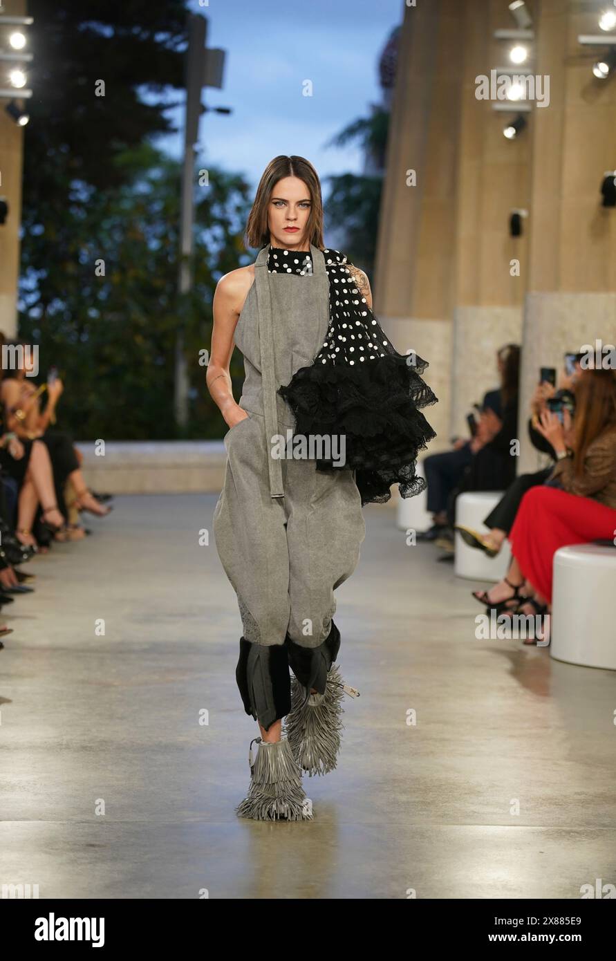 A model wears a creation by Louis Vuitton during a fashion show for the ...