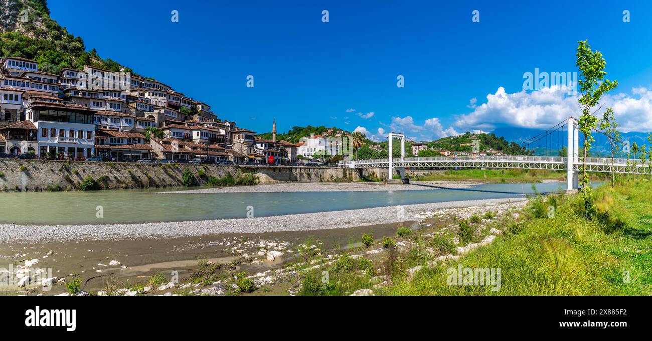 A view across the River Osum and the pedestrian bridge in Berat ...