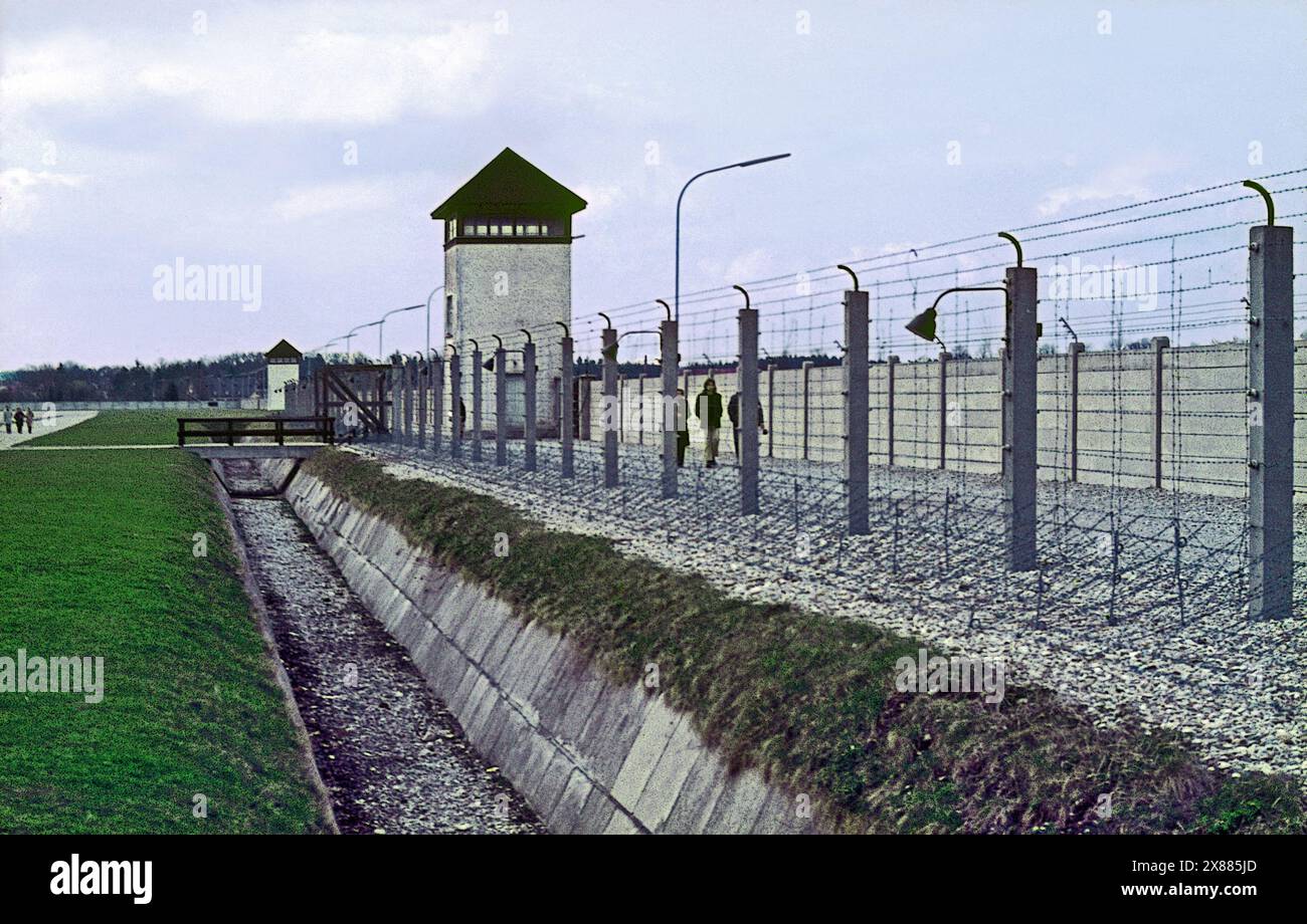 Dachau concentration camp.Fence with barbed wire. In front of the control tower.(Year 1973 Stock ...