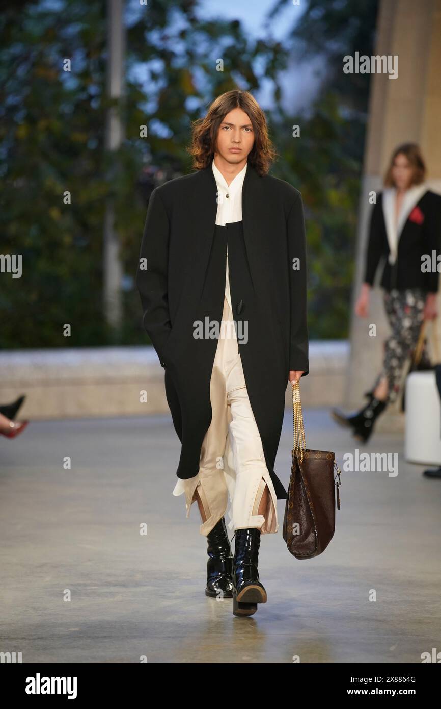 A model wears a creation by Louis Vuitton during a fashion show for the ...