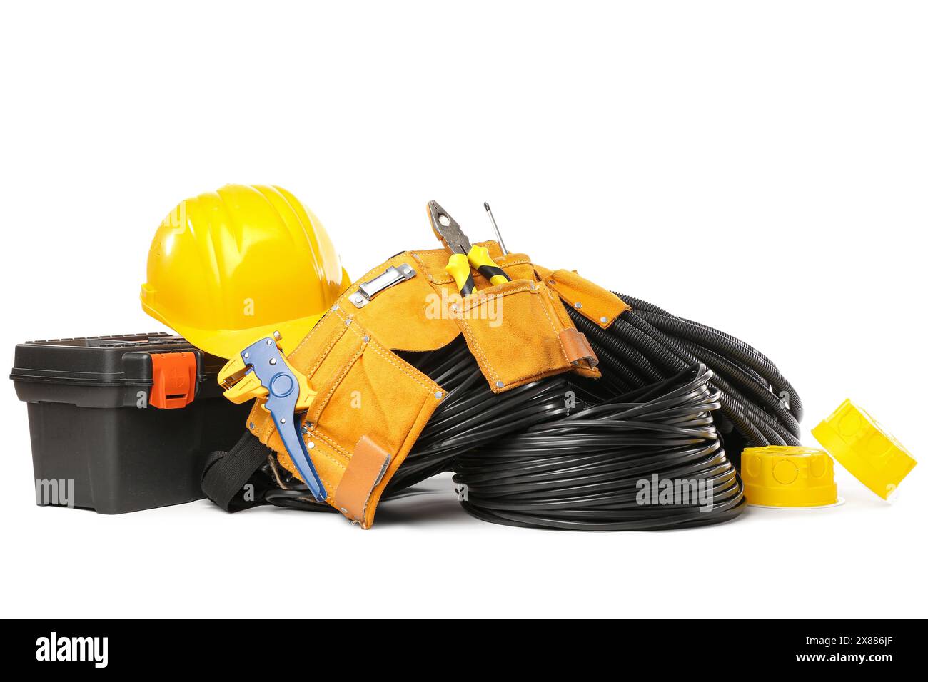 Tool belt, rolled cables, electrical junction boxes and hardhat on ...