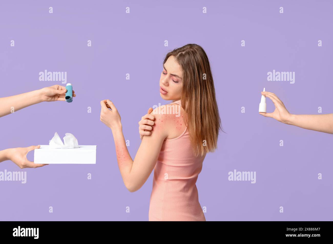 People giving inhaler, nasal spray and tissue box to young woman ...