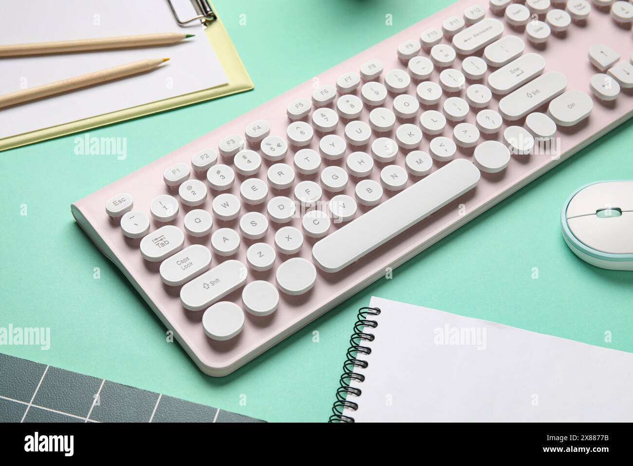 PC keyboard and stationery on turquoise background Stock Photo - Alamy
