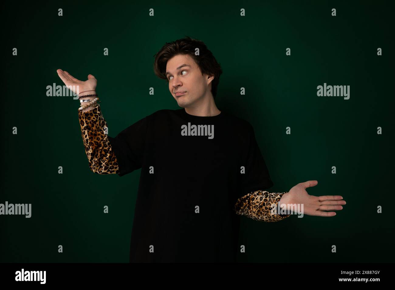 Man in Black Shirt Holding Arms Out Stock Photo - Alamy