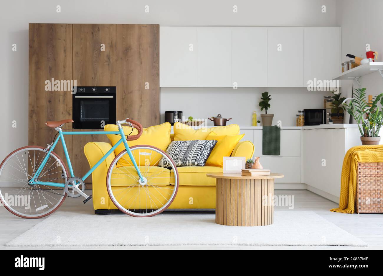 Interior of beautiful living room with yellow sofa, coffee table ...