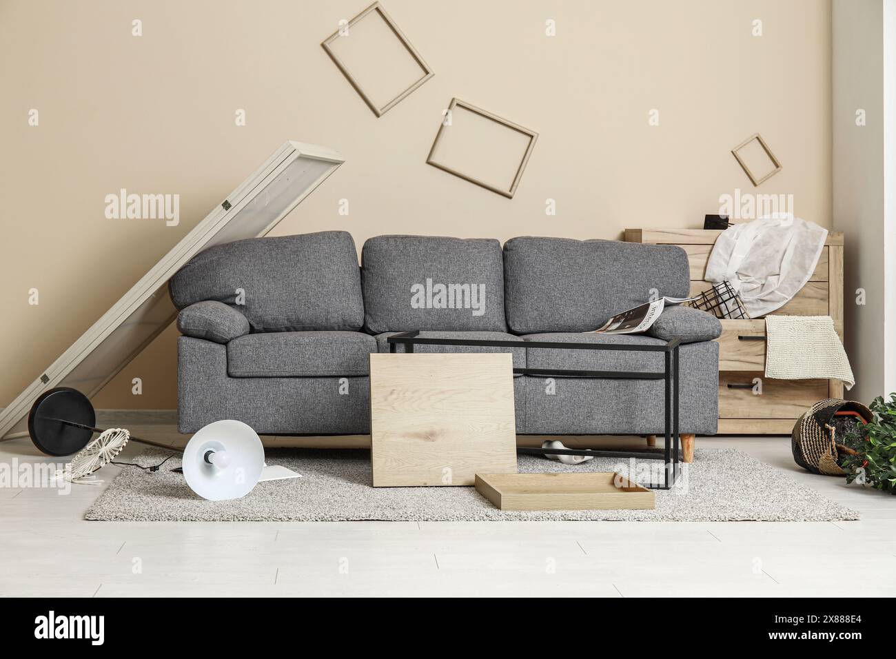 Interior of living room with sofa after earthquake Stock Photo - Alamy