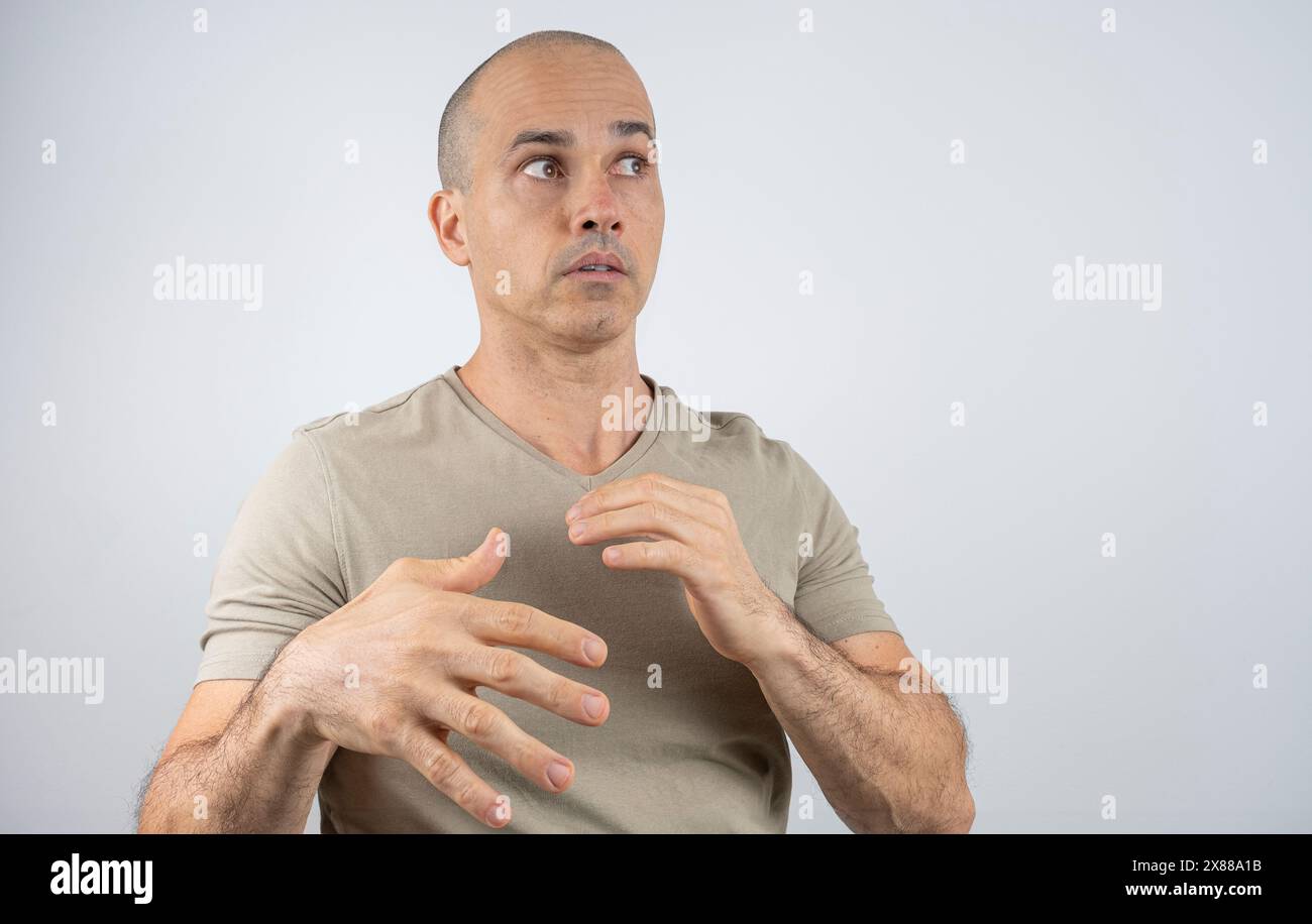 Caucasian, Brazilian man, 48 years old, in the studio showing emotions ...